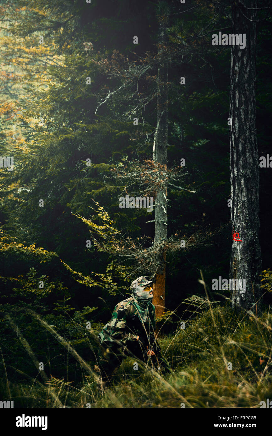 Crouching on tree trunk hi-res stock photography and images - Alamy