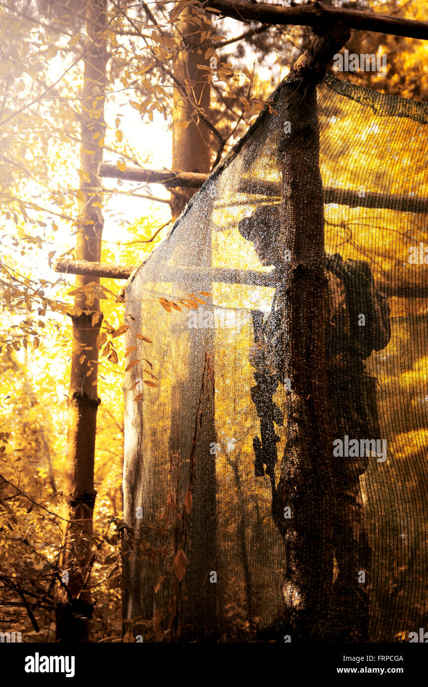 Masked competitor behind the safety net Stock Photo - Alamy