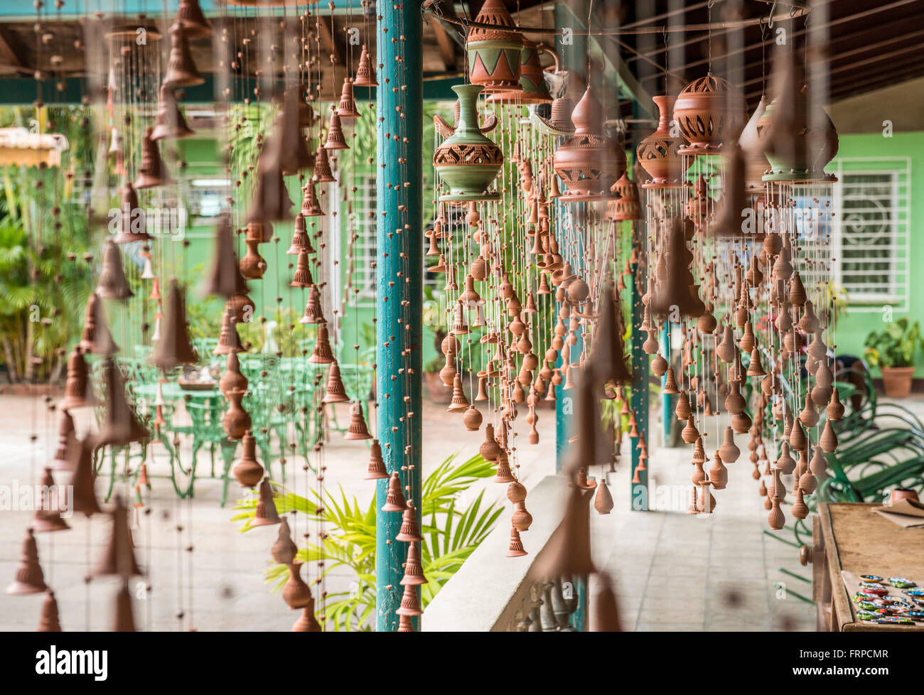Spiral clay wind chimes on display in the studio of Daniel "Chichi ...