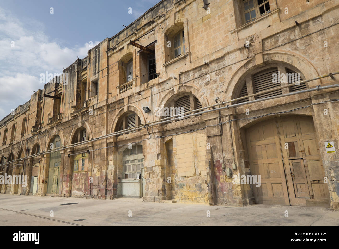 Dockside buildings at Dockyard Creek, Senglea in Malta Stock Photo - Alamy