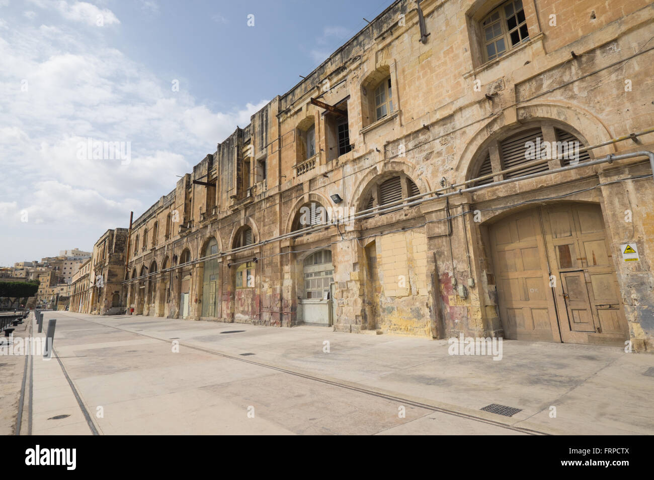 Dockside buildings at Dockyard Creek, Senglea in Malta Stock Photo - Alamy