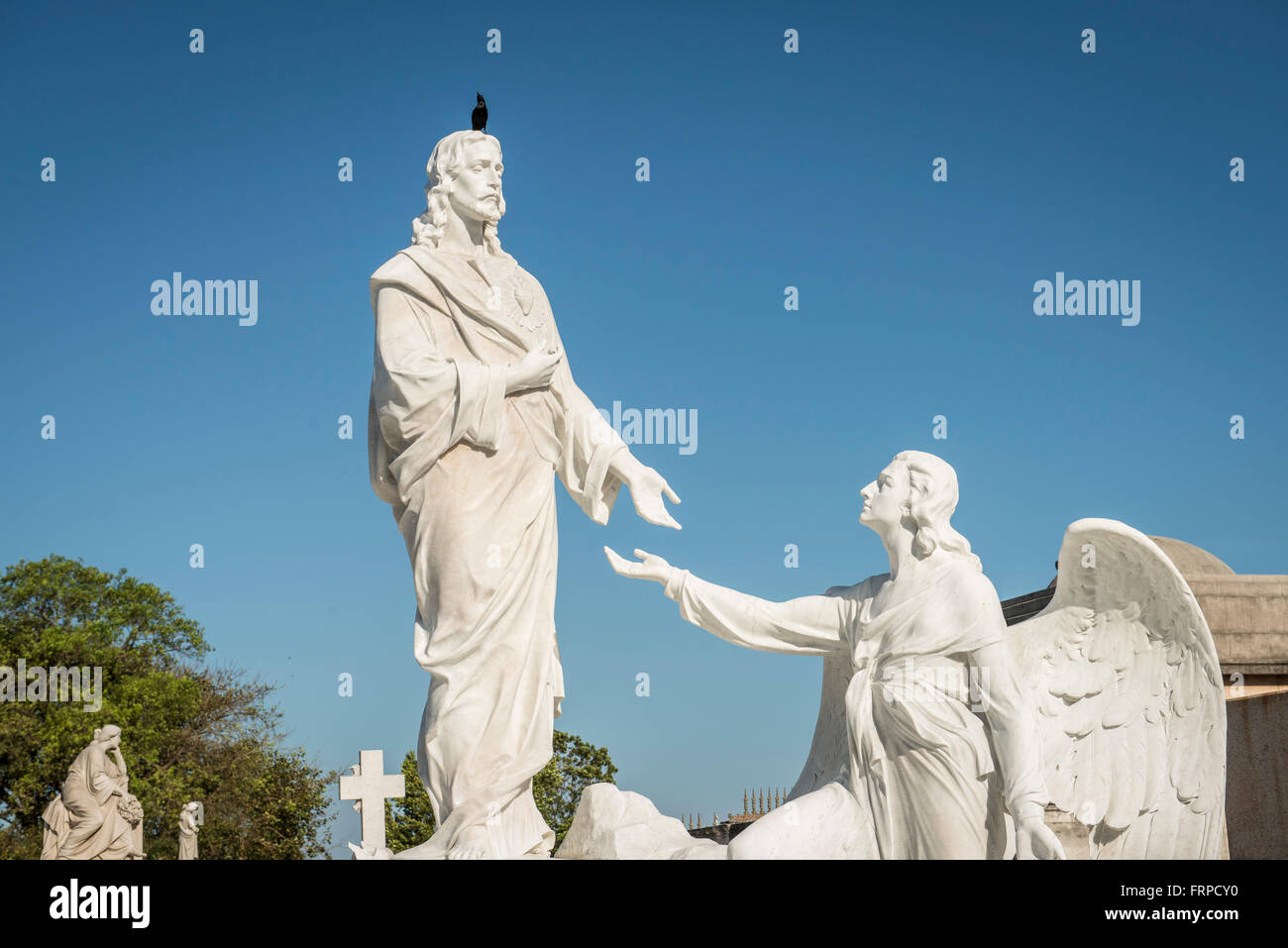 Statue of Jesus and an Angel in Cuban Cemetery Stock Photo - Alamy