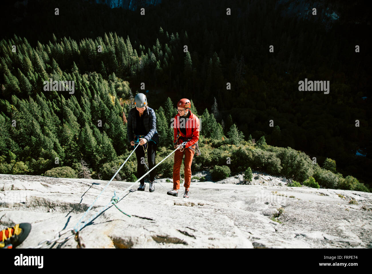 Two climbers on a double rope simul rappel on The Grack (5.6 Stock ...
