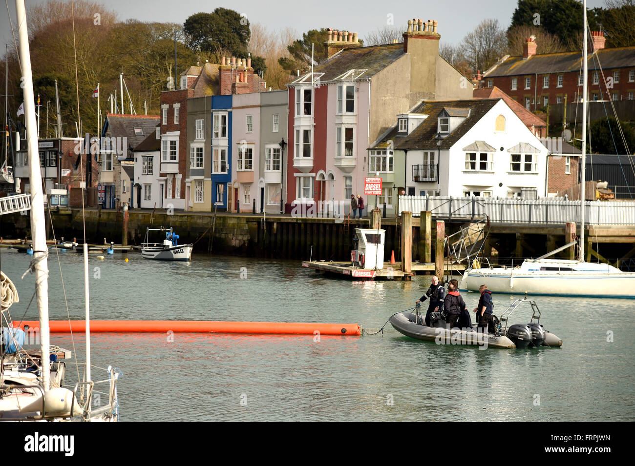 Oil pollution containment boom deployment exercise at Weymouth Harbour ...