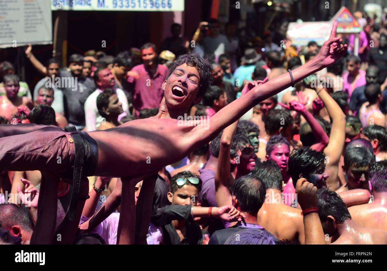 Allahabad, India. 23rd Mar, 2016. Indian revelers dance as they ...