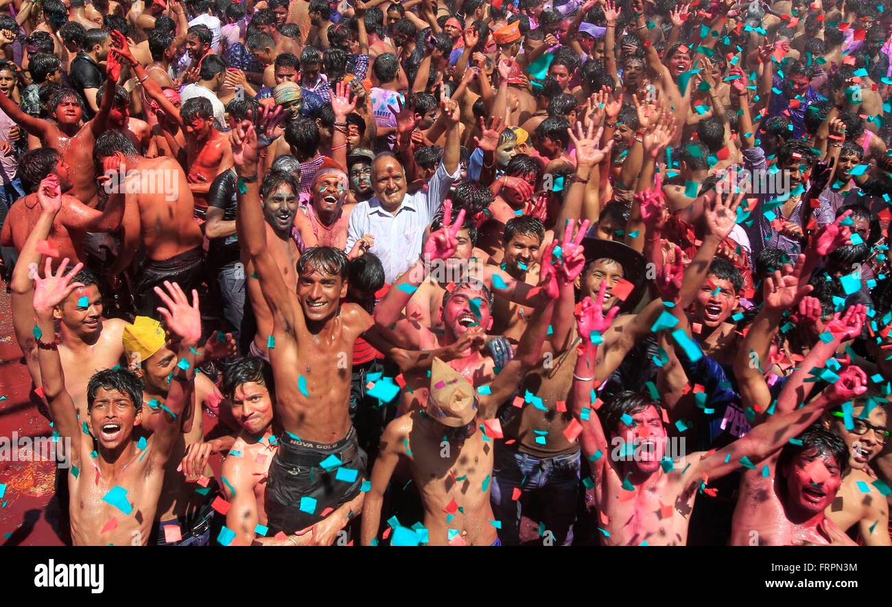 Allahabad, India. 23rd Mar, 2016. Revelers' faces smeared with colors ...