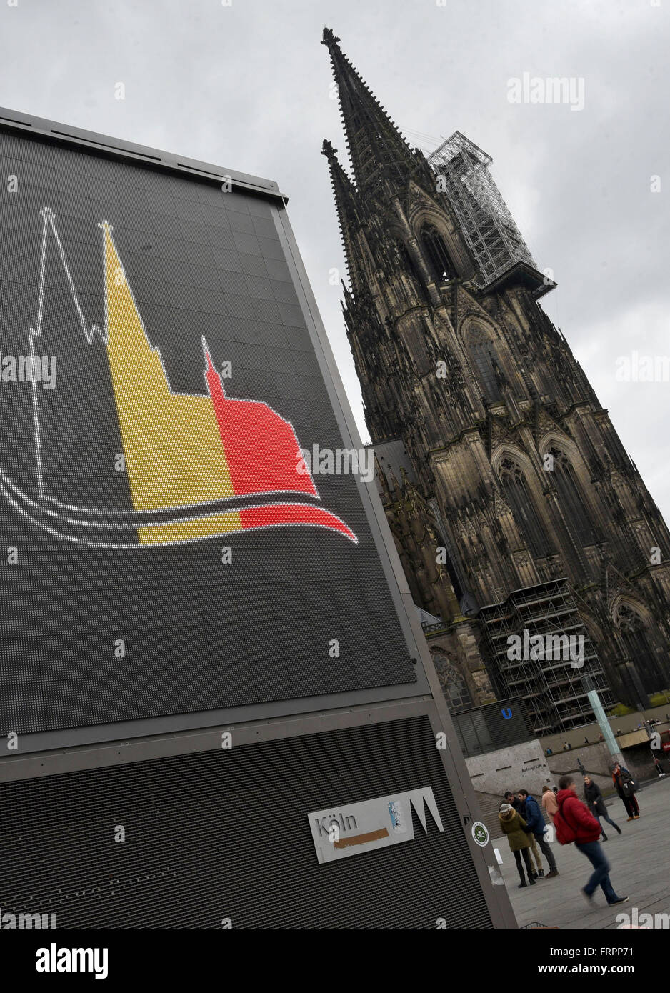 Cologne, Germany. 23rd Mar, 2016. An advertising board shows a picture ...