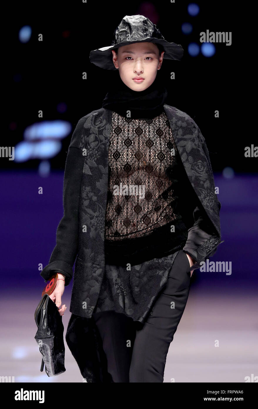 Beijing, China. 23rd Mar, 2016. Model Tian Lin competes in the final of ...
