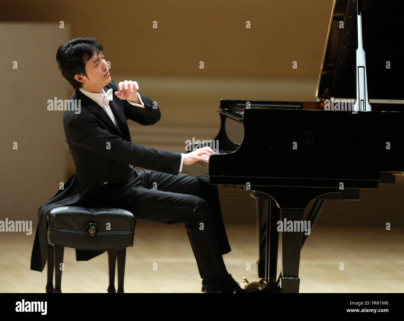 New York, USA. 23rd Mar, 2016. Pianist Li Yundi performs during his ...