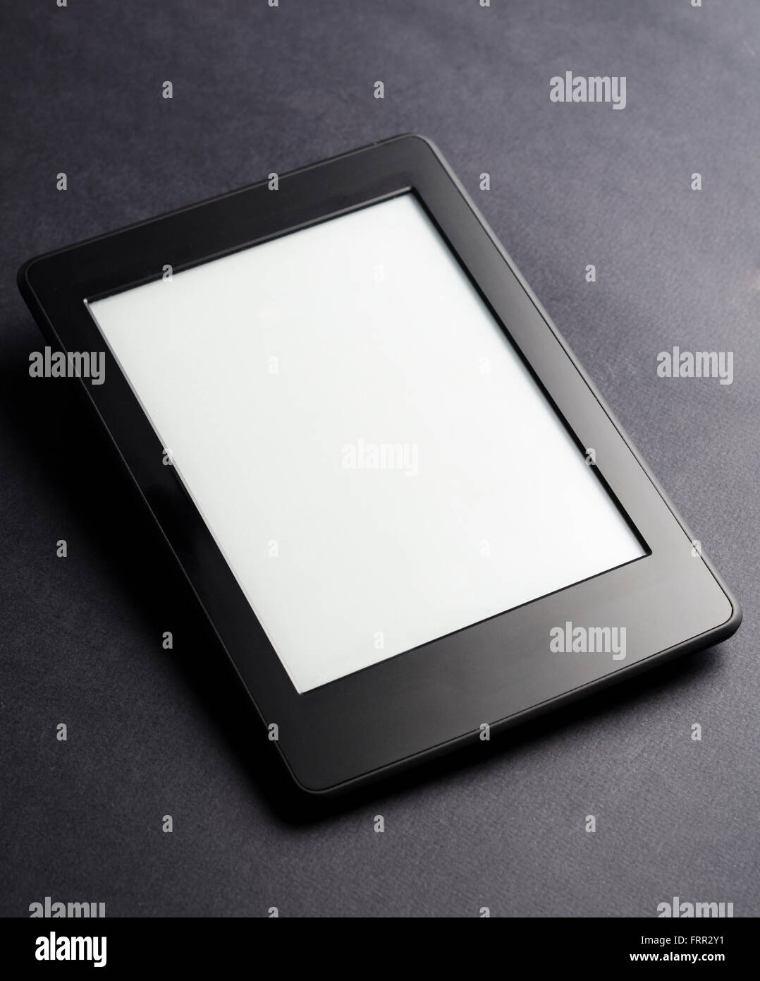 Ebook reader on black background with white screen Stock Photo - Alamy
