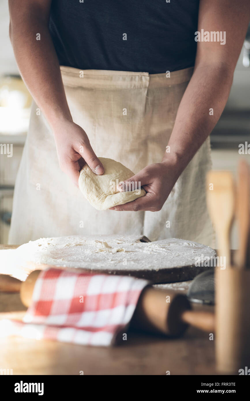 Man baking bread in kitchen Stock Photo - Alamy
