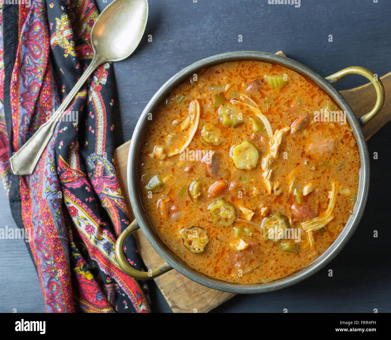 Copper pot filled with chicken and sausage gumbo Stock Photo - Alamy