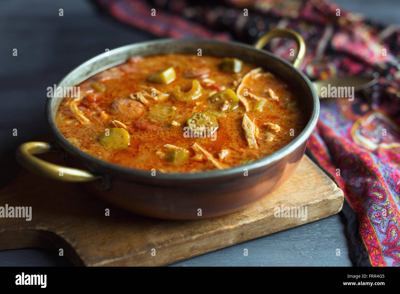 Copper pot filled with chicken and sausage gumbo Stock Photo - Alamy