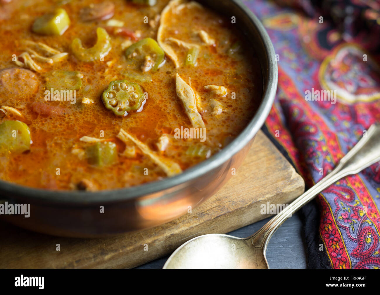Copper pot filled with chicken and sausage gumbo Stock Photo - Alamy