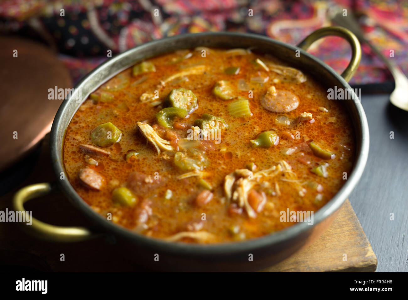 Copper pot filled with chicken and sausage gumbo Stock Photo - Alamy