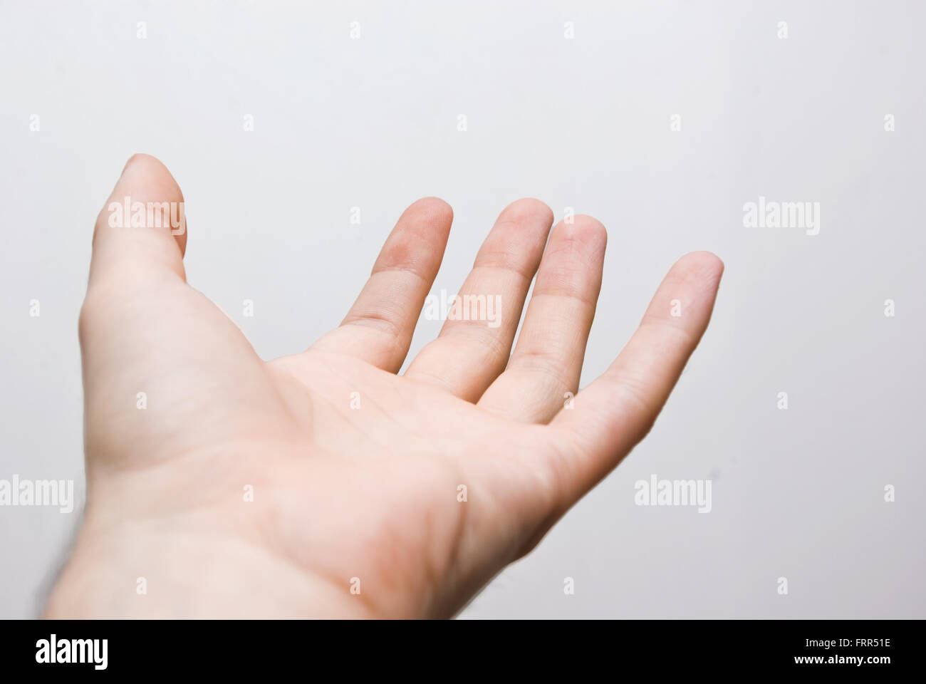 giving hand isolated grey background Stock Photo - Alamy
