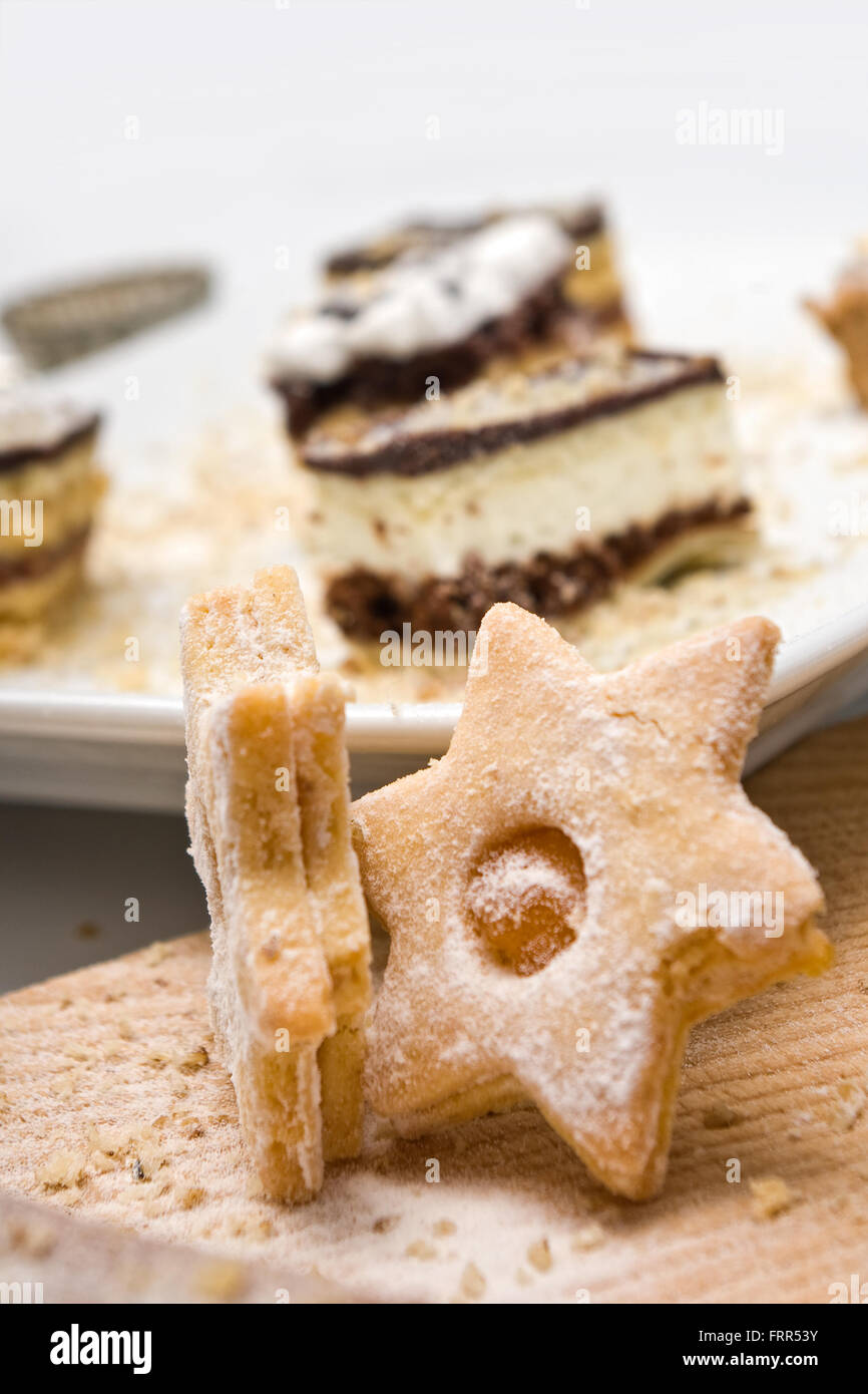 homemade sweets in shape of a star with bar cookies in the background ...