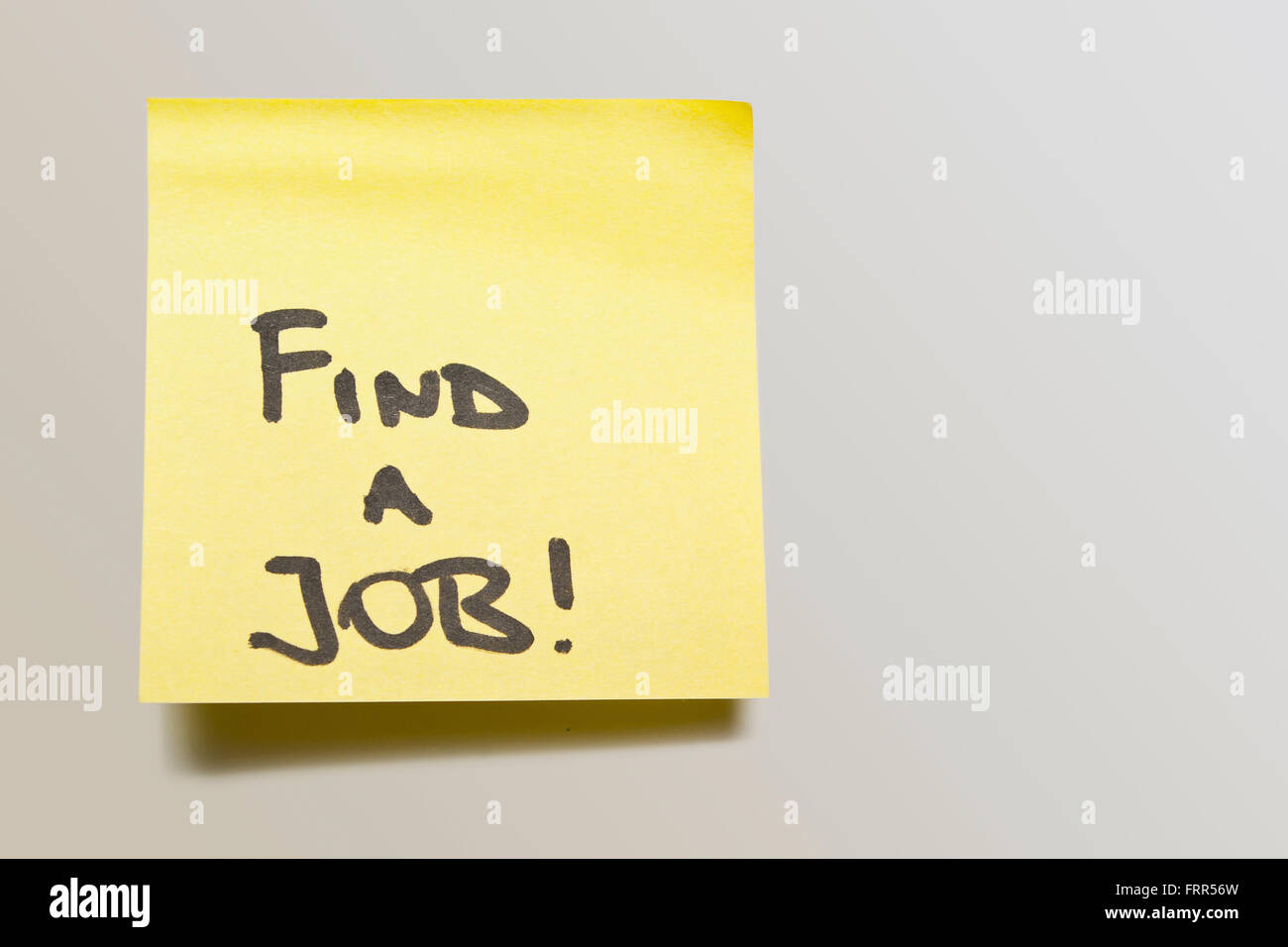 yellow adhesive note on white background with "find a job" note Stock ...