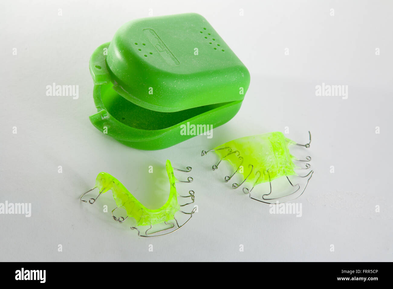 Acrylic dental retainer on white with box Stock Photo - Alamy