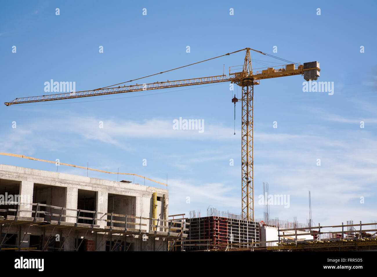 construction crane working on a new building Stock Photo - Alamy