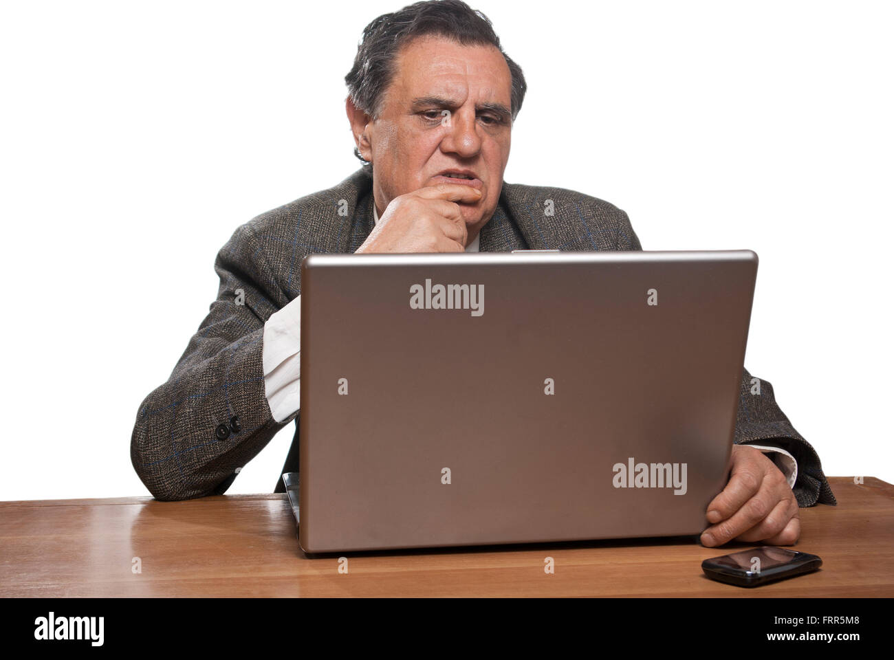 Portrait of a worried business man with a laptop isolated on white ...