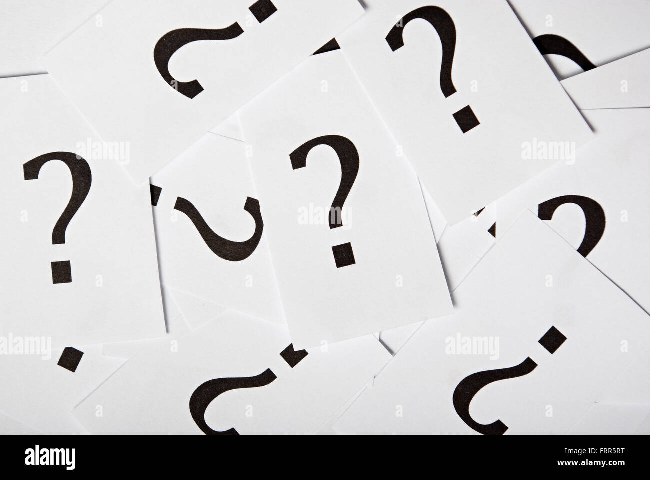 Questions concept with question marks on paper Stock Photo - Alamy