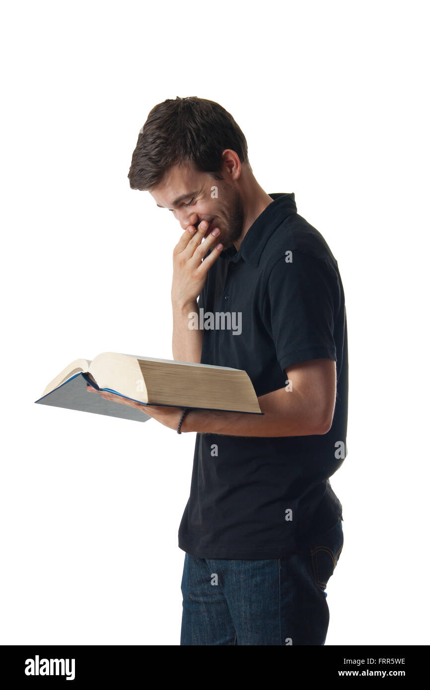 Man standing reading from a large book and laughing isolated on white ...