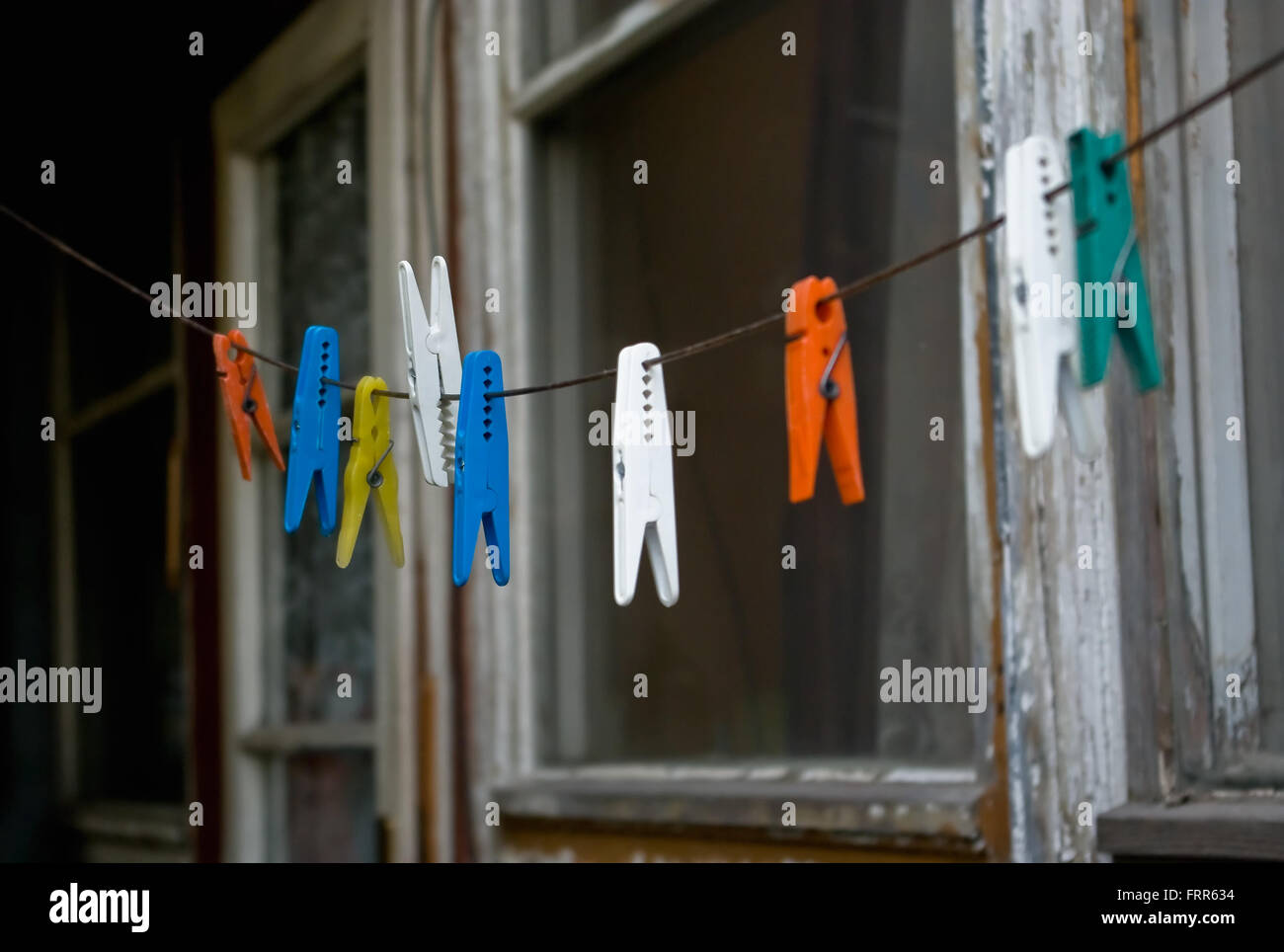 clothes peg lined on a wire Stock Photo - Alamy