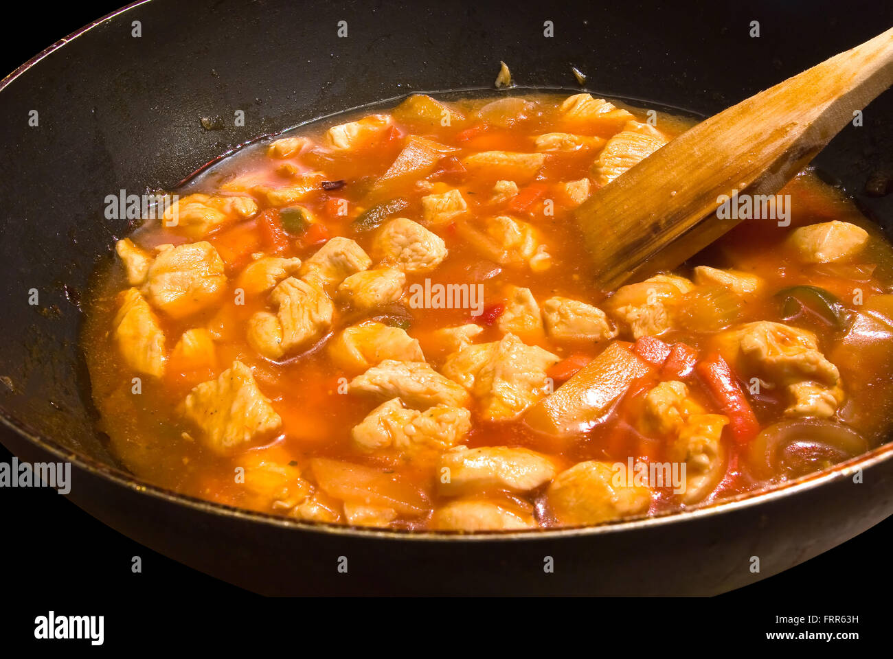 chopped chicken cooking in a sweet and sour sauce, chinese food Stock ...