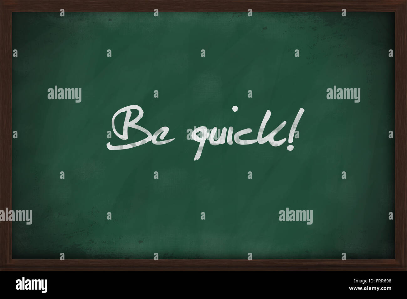 Be quick written on a green chalkboard Stock Photo - Alamy
