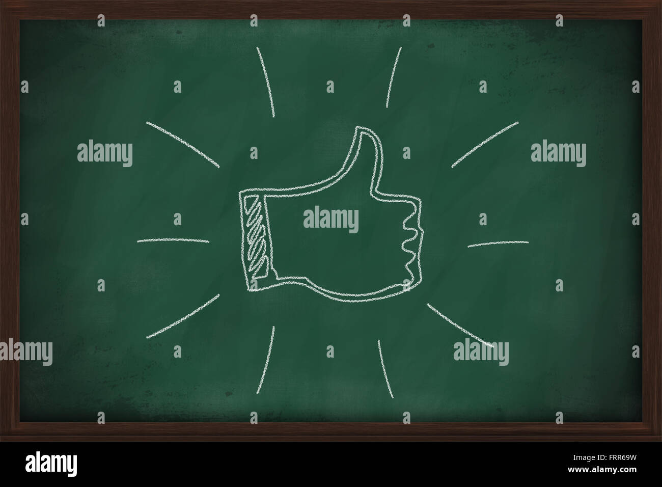 Thumb up on the green chalkboard social media concept Stock Photo - Alamy