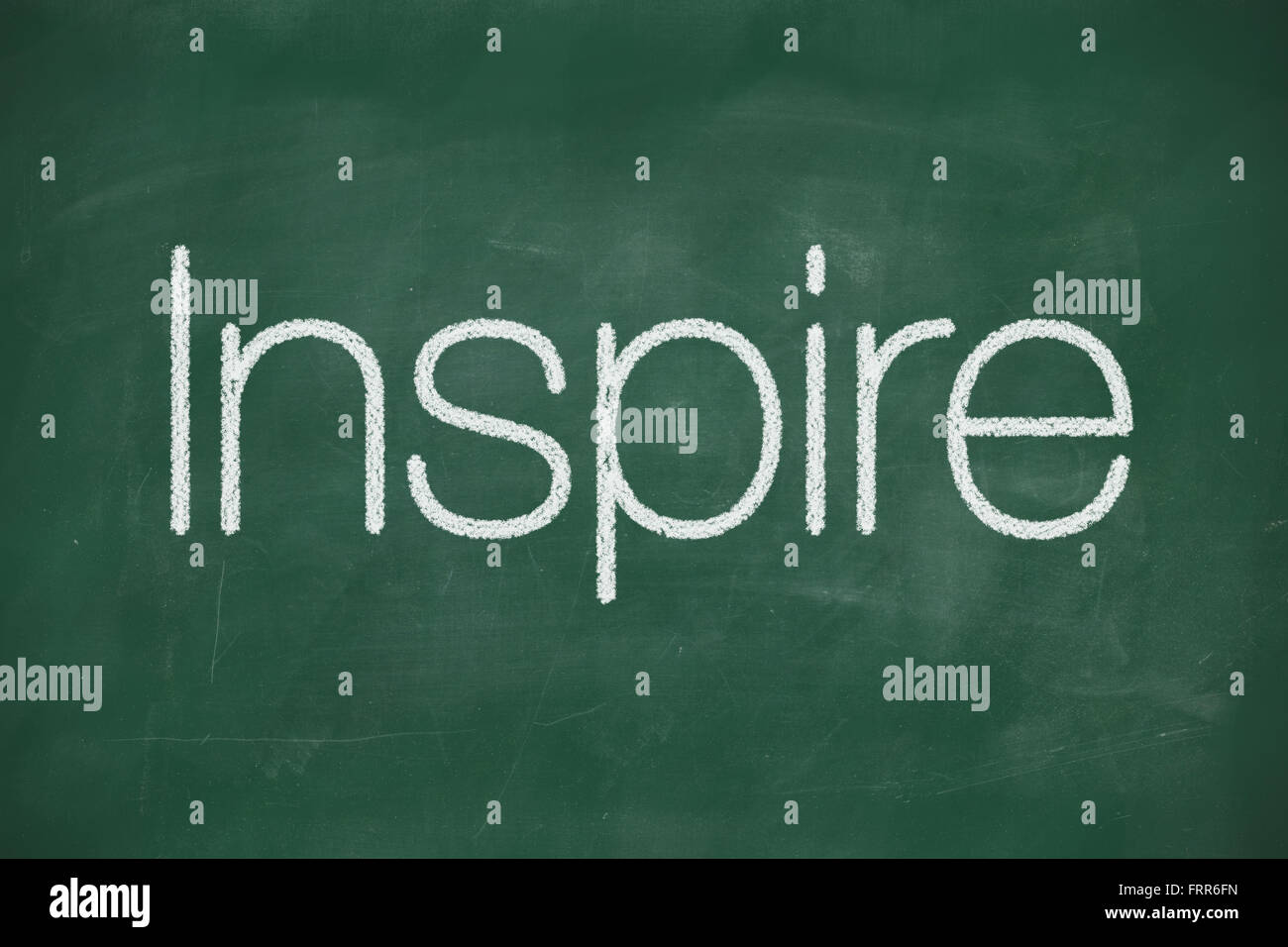Inspire handwritten with white chalk on a blackboard Stock Photo - Alamy