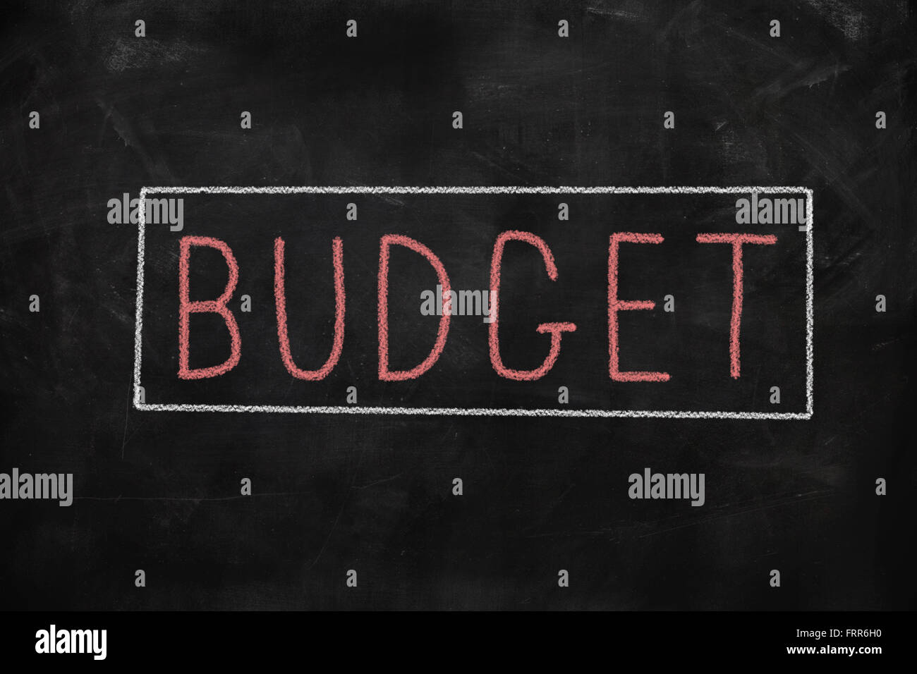 Budget handwritten on a blackboard with chalk Stock Photo - Alamy