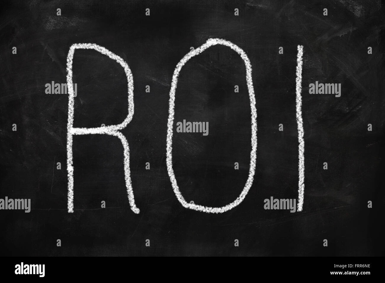 The word ROI handwritten with white chalk on a blackboard Stock Photo ...