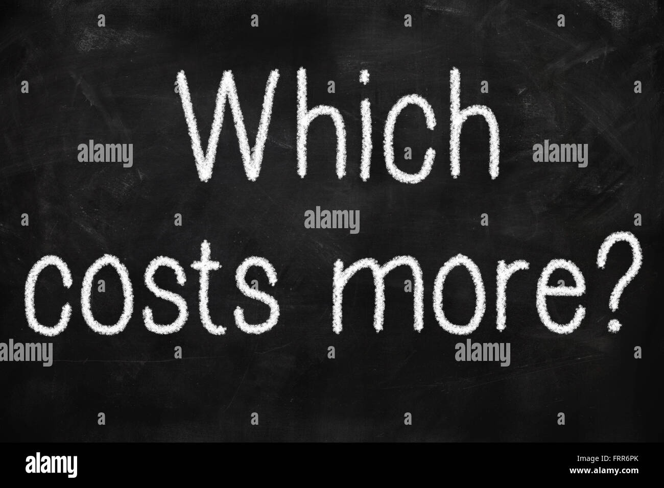 Which costs more business concept on a blackboard Stock Photo - Alamy