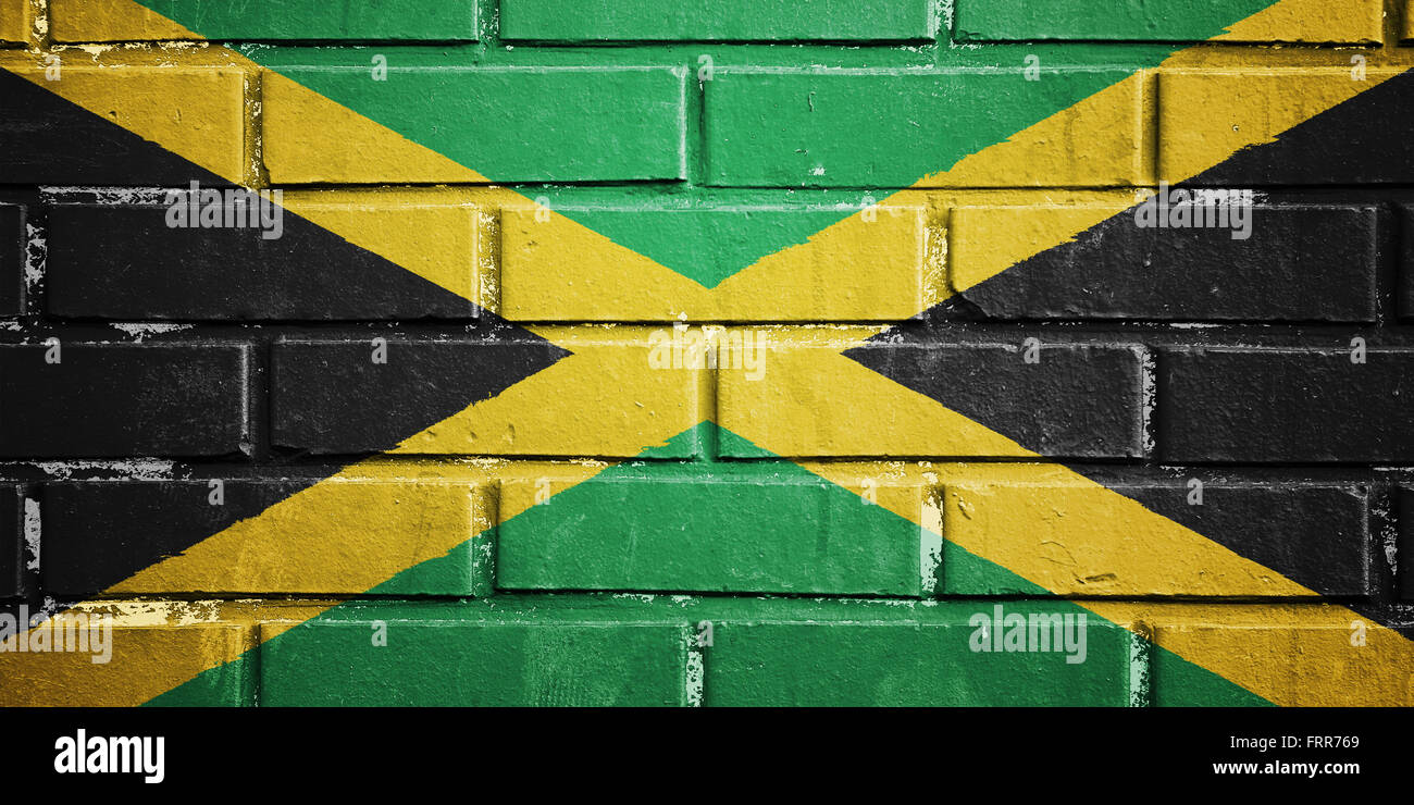 Jamaica flag on texture brick wall Stock Photo - Alamy