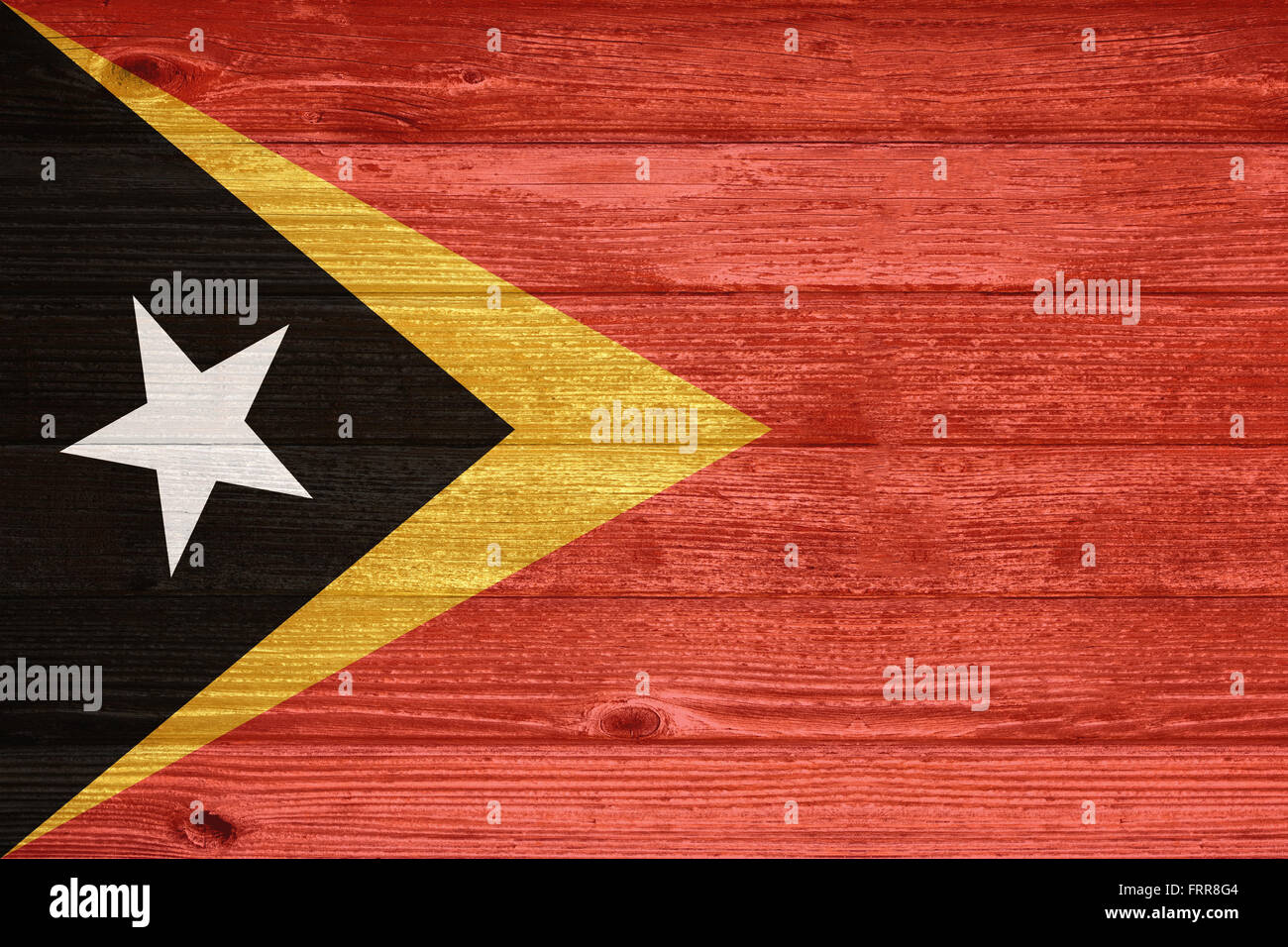 East Timor Flag painted on old wood plank background Stock Photo - Alamy