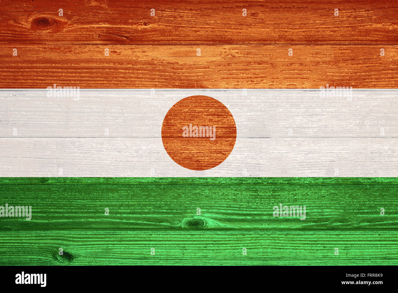 Niger Flag painted on old wood plank background Stock Photo - Alamy