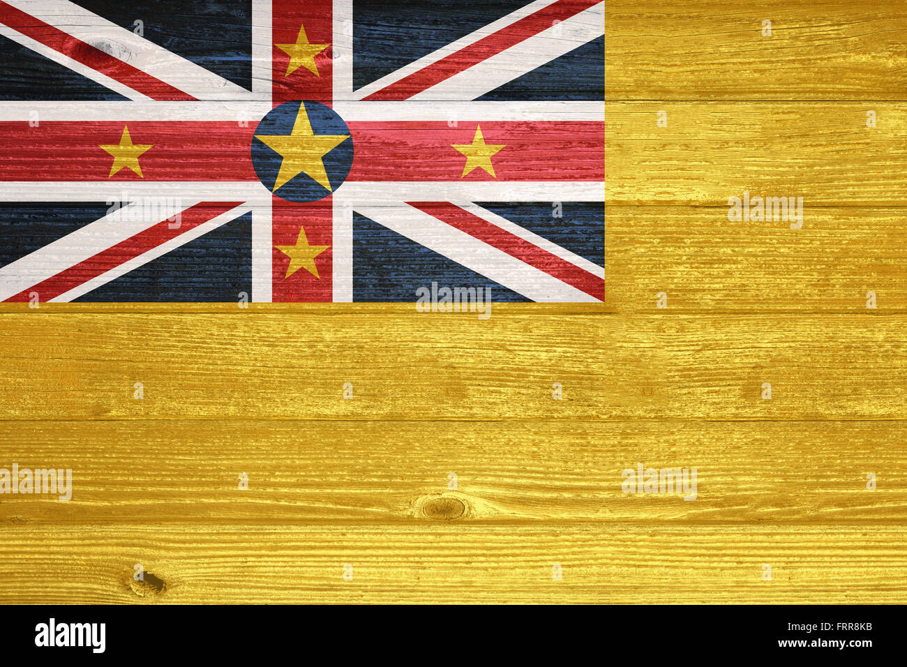 Niue Flag painted on old wood plank background Stock Photo - Alamy