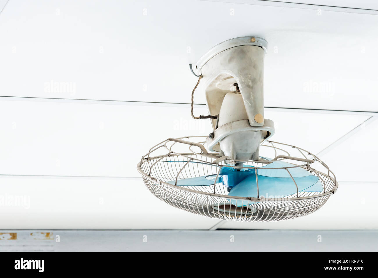 Dirty orbit fan on the ceiling of living room Stock Photo - Alamy