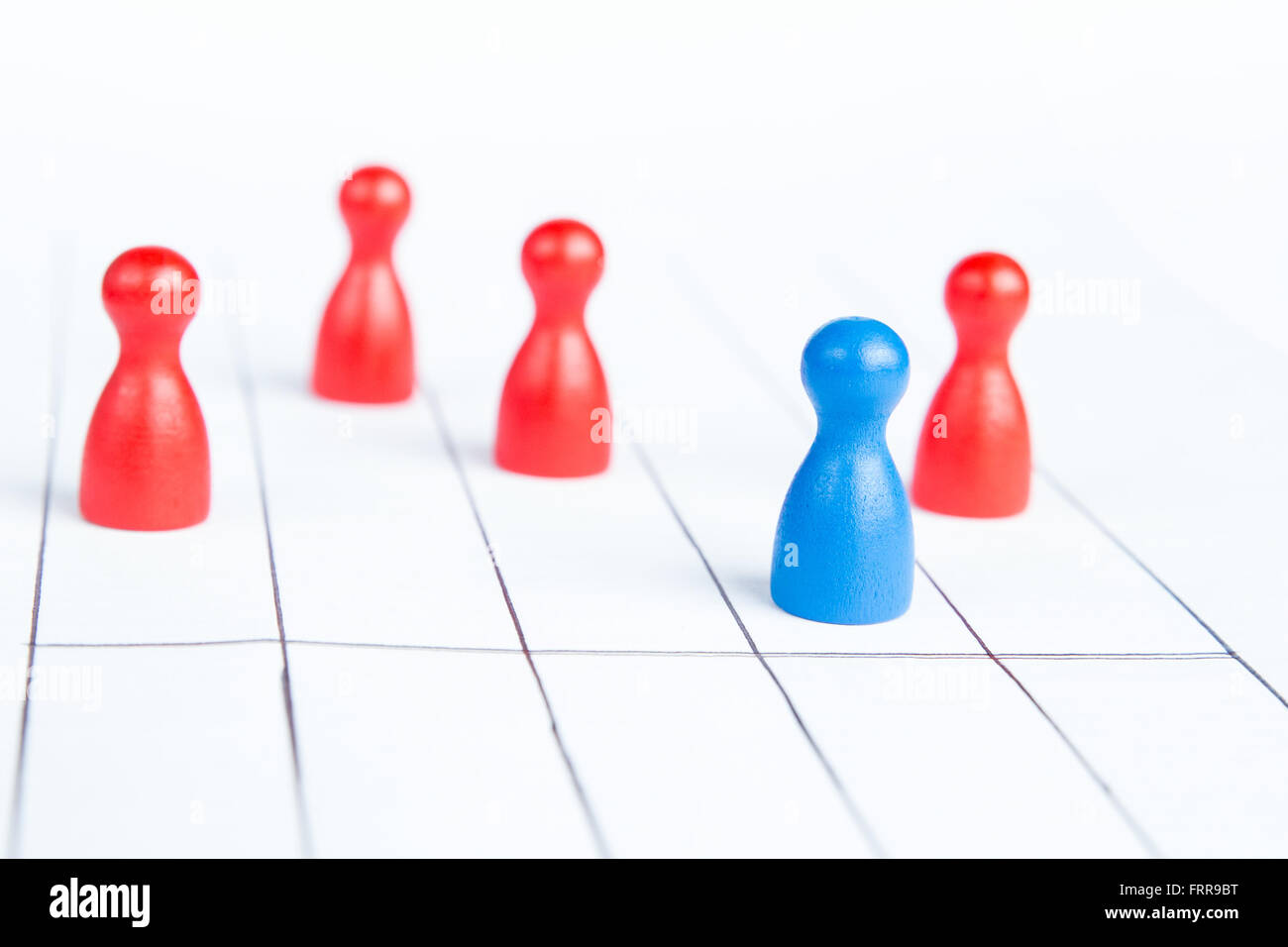 Winning the business race concept with blue pawn beating red pawns on ...