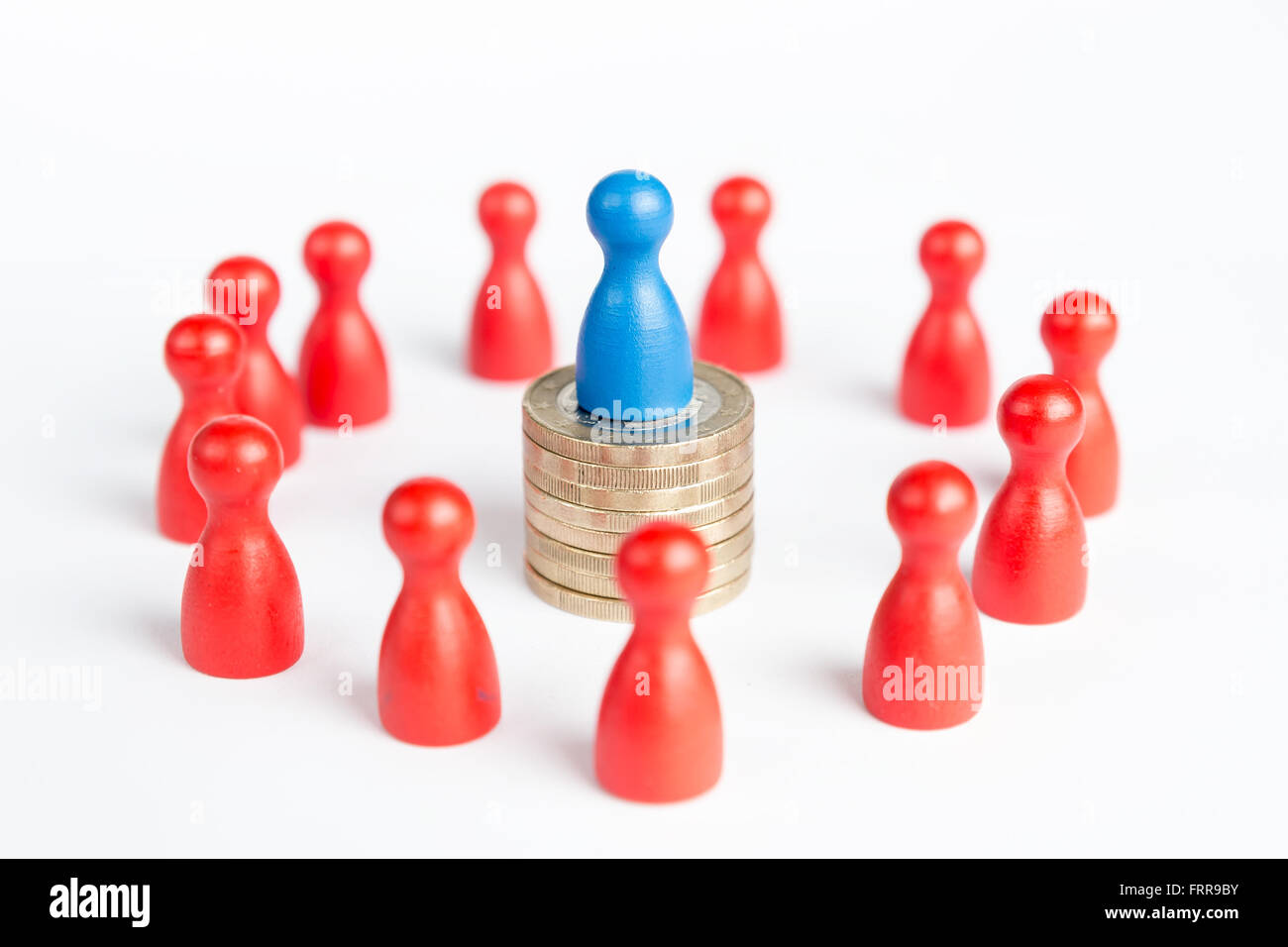 Rich business leader concept with blue figure on top of coin stack as a ...