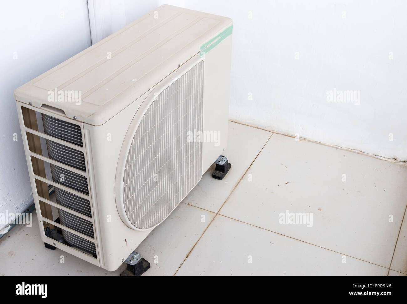 Air compressor unit is standing outside the urban building Stock Photo ...