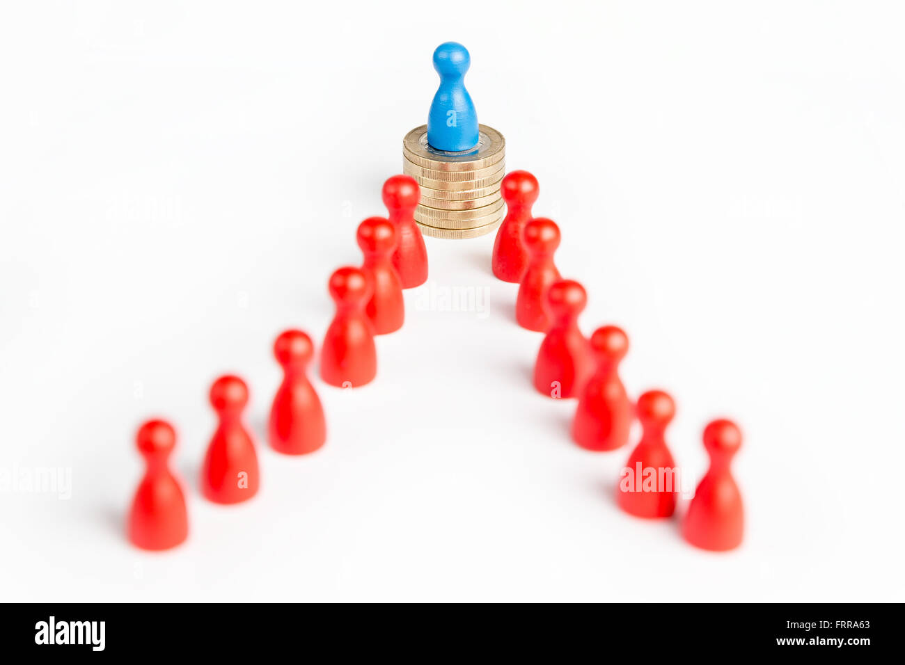 Rich business leader concept with blue figure on top of coin stack as a ...