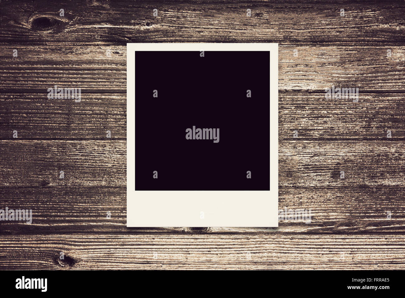 one Polaroid retro frame on wood texture nostalgic vintage look Stock ...