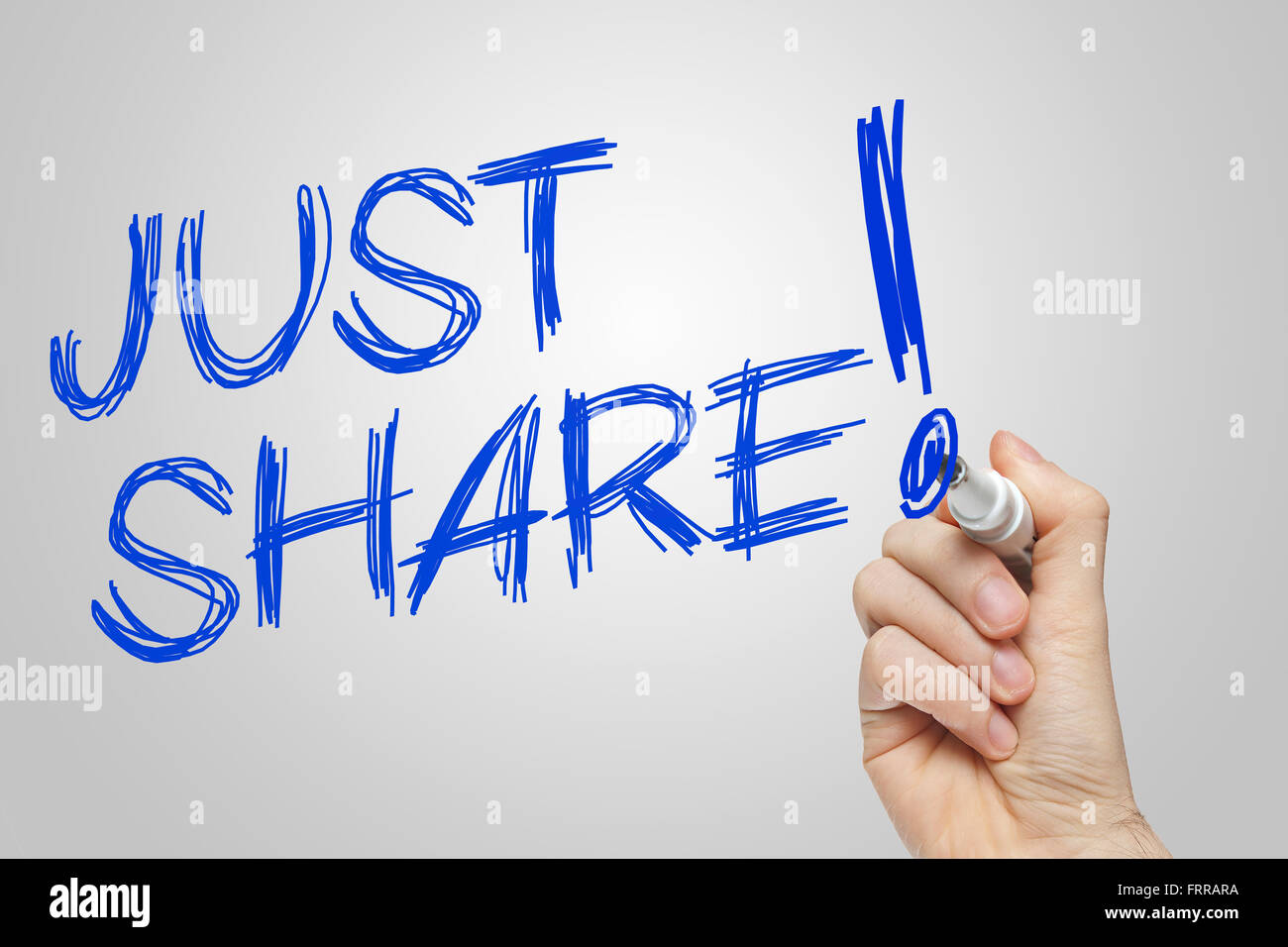 Just Share hand writing with blue marker on a white wipe board Stock ...