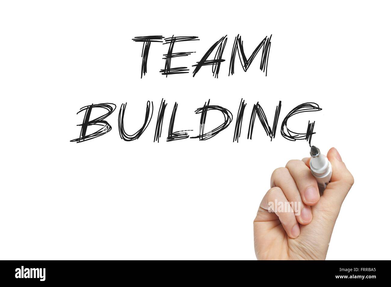 Hand writing team building on a white board Stock Photo - Alamy