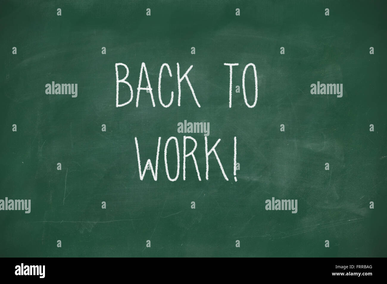 Back to work handwritten on school blackboard Stock Photo - Alamy