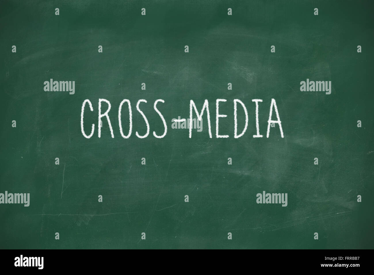 Cross media handwritten on school blackboard Stock Photo - Alamy