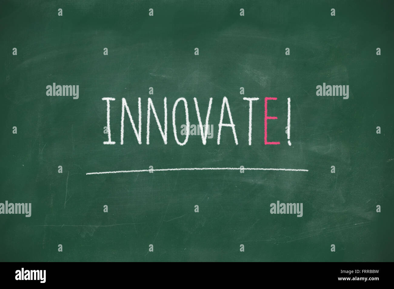 Innovate handwritten on school blackboard Stock Photo - Alamy